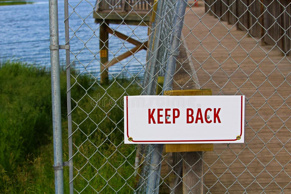 A Keep Back Sign on a Chain-link Fence Stock Photo - Image of alberta ...