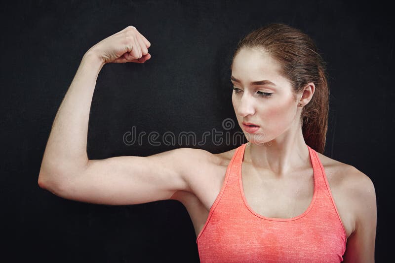 Keep Calm and Build Muscles. a Young Woman Flexing Her Muscles. Stock ...