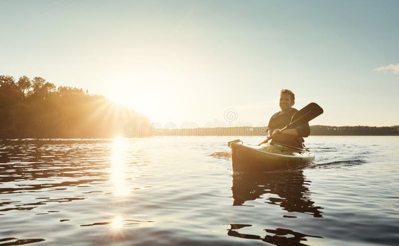 Keep Calm and Go Kayaking. a Young Man Kayaking on a Lake Outdoors ...