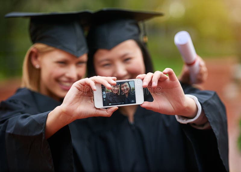 Keep Calm and Take a Selfie. Two College Graduates Taking a Selfie ...