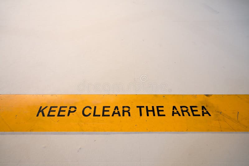 Keep Clear Warning Sign in Yellow Banner on the Floor, with Copy Space ...