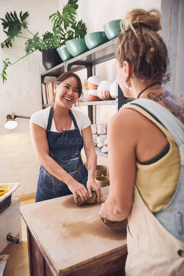 Keep Creating, Keep Smiling. Two Young Women Kneading Clay in a Pottery Studio. Stock Image ...
