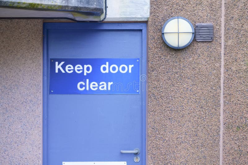 Keep Clear 24 Access Required Sign At Business Entrance Roller Shutter ...