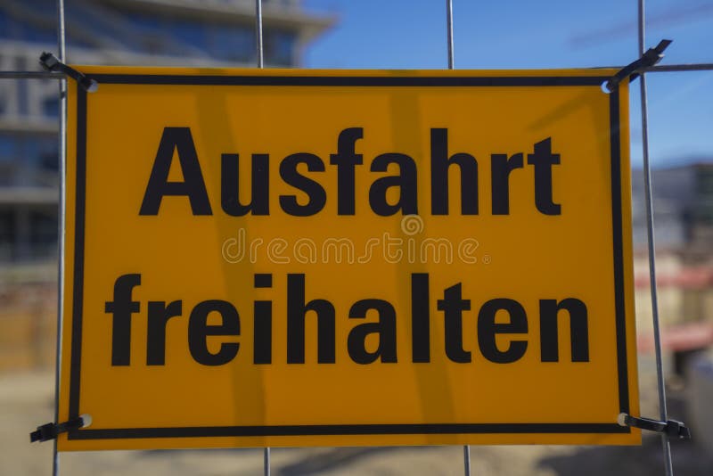 Keep Exit Free Sign in German on Yellow Plastic Stock Image - Image of ...