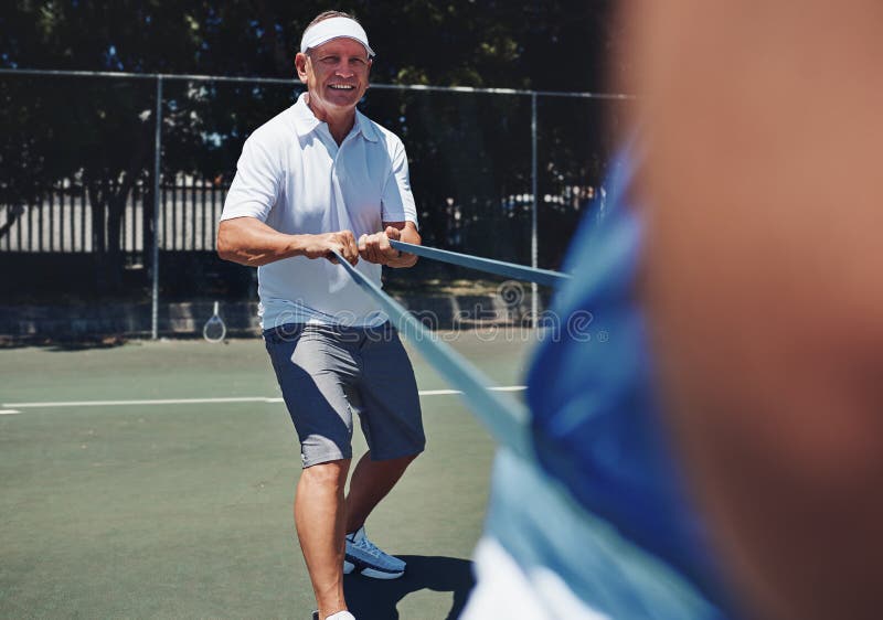 Keep Going. Two Handsome Sportsmen Using Resistant Bands during a ...