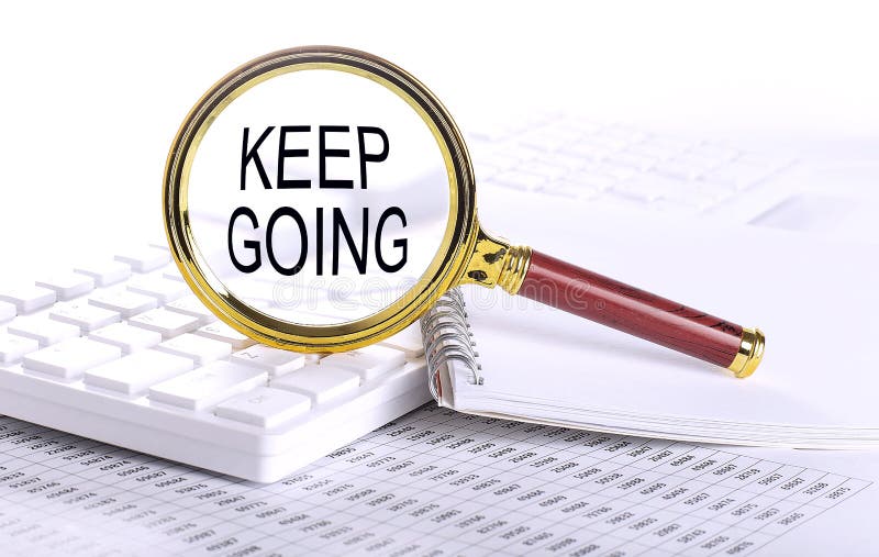 KEEP GOING Word through Magnifying Glass on Keyboard on the Chart Stock ...
