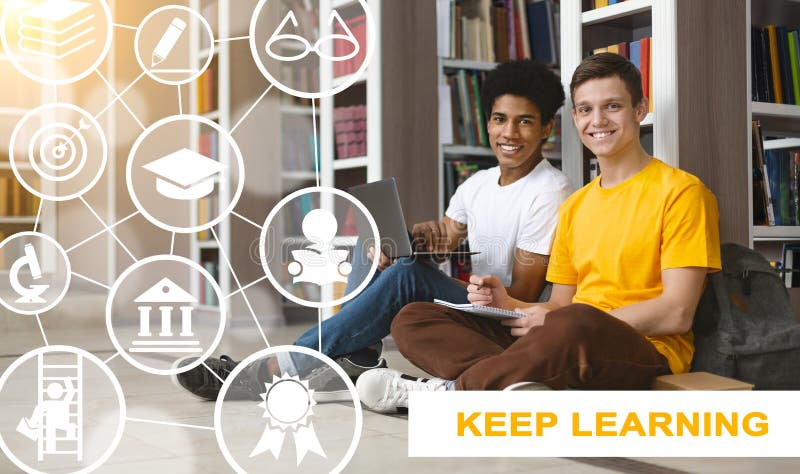 Two Diverse Students Studying Using Computers Sitting in Library ...