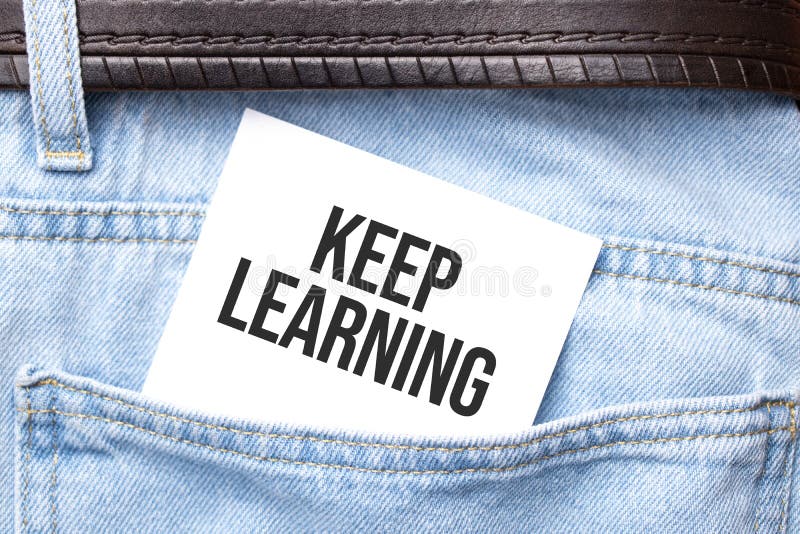 Keep Learning Words on a White Paper Stuck Out from Jeans Pocket ...