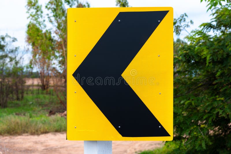 Keep left warning signpost stock image. Image of trees - 330284947