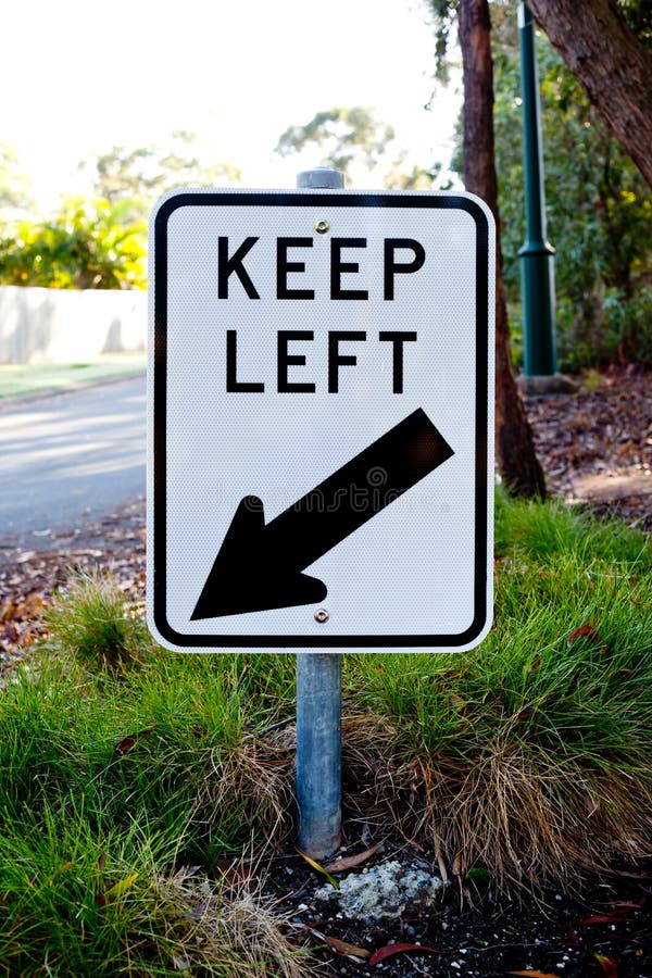 Keep Left Road Sign stock image. Image of roadside, green - 95113647