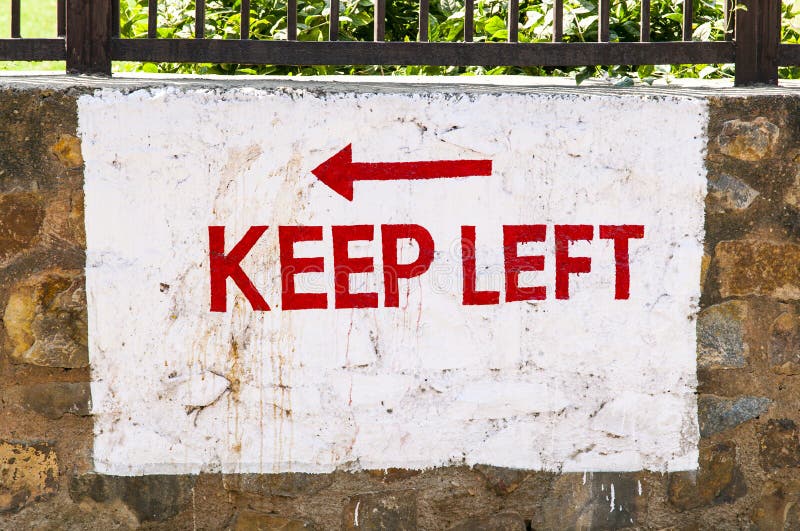 Keep Left Sign Painted at a Wall Stock Image - Image of paint, left ...