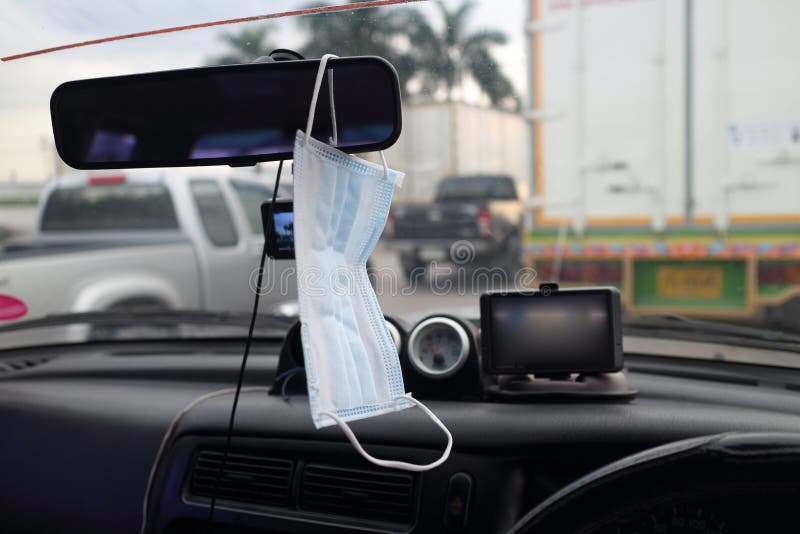 Keep mask in car on road stock photo. Image of facemask - 207175626