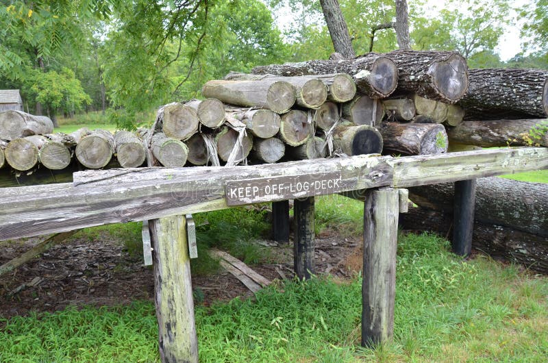 Keep Off Log Deck Sign with Wood Structure and Logs Stock Photo - Image ...
