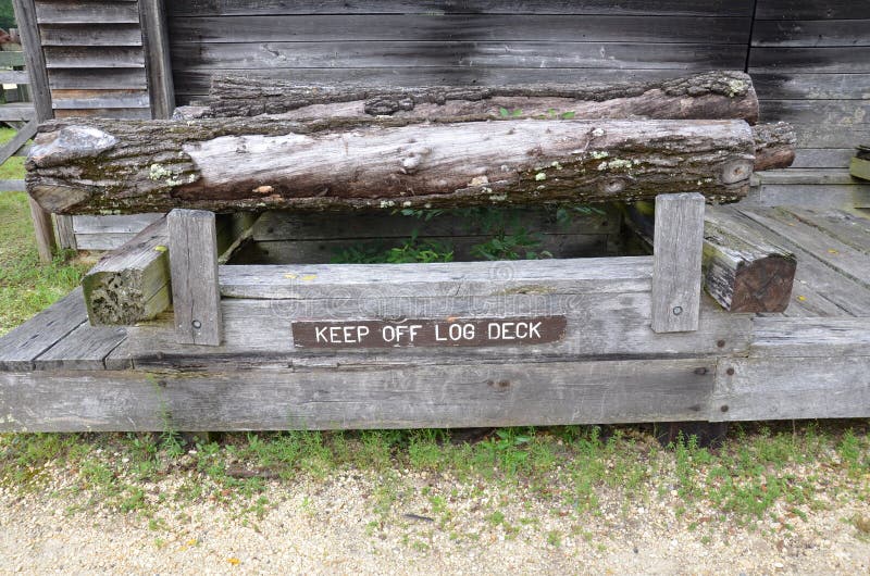 Keep Off Log Deck Sign with Wood Structure and Logs Stock Photo - Image ...
