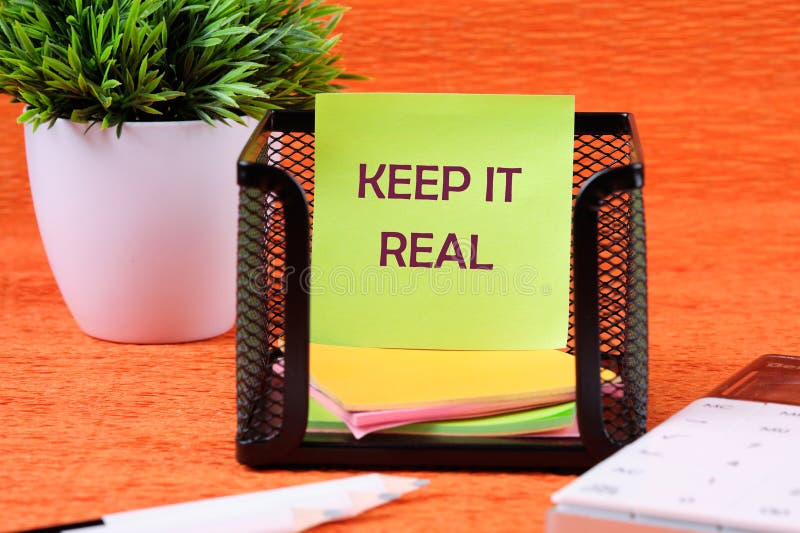 KEEP it REAL Text on a Light Green Ticker in Front of an Orange ...