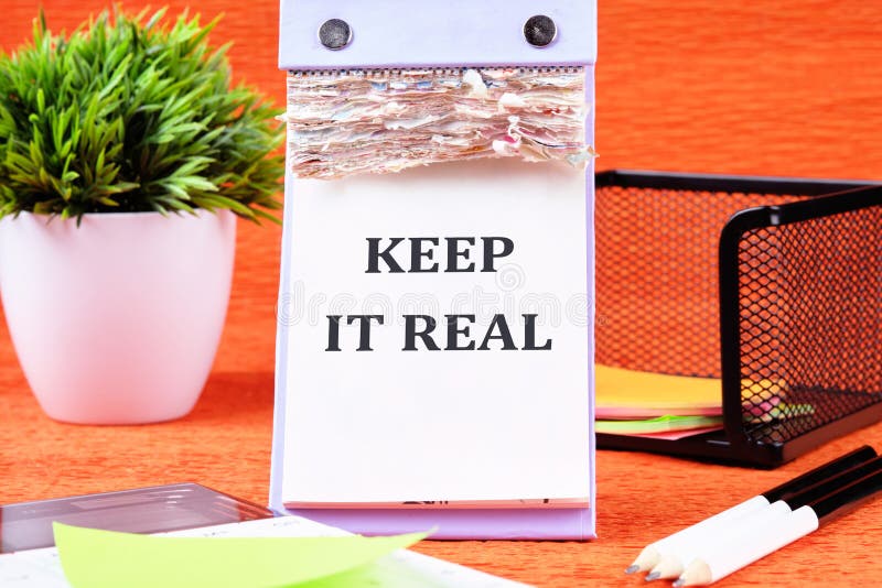 KEEP it REAL Text on a Loose Leaf of a Desktop Notebook Stock Image ...