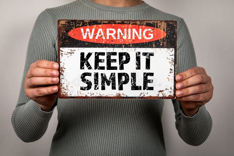 Keep it Simple. Warning Sign with Text in a Woman& X27;s Hand Stock ...