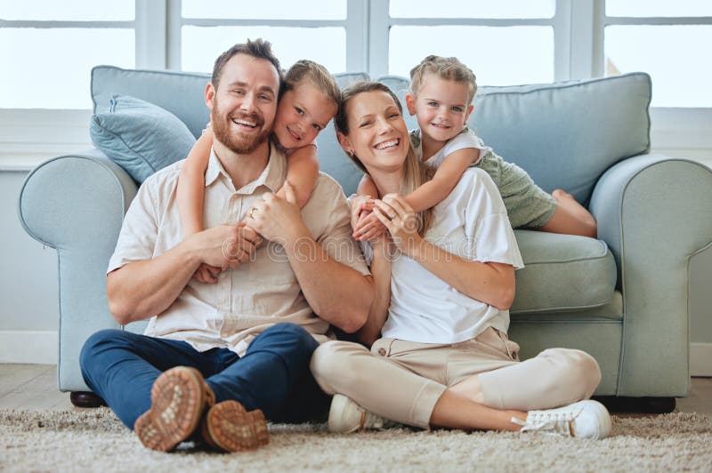 Keep a Smile on Your Face. a Young Family Relaxing at Home. Stock Photo ...