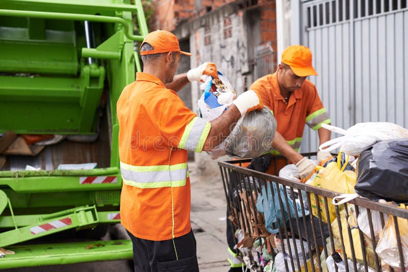 Keeping the City Clean. a Team of Garbage Collectors. Stock Image ...