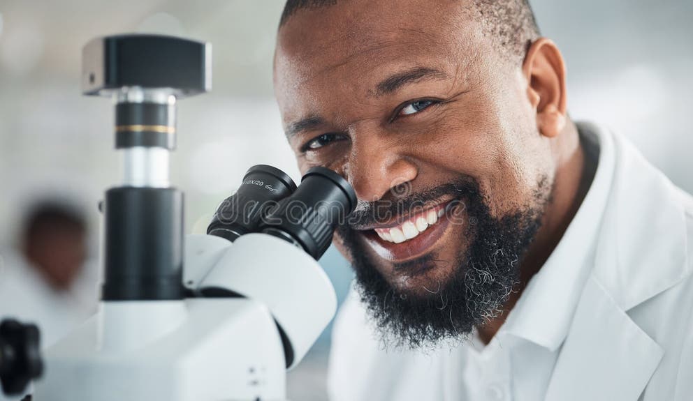 Keeping an Eye on the Reaction. a Mature Man Using a Microscope in a ...