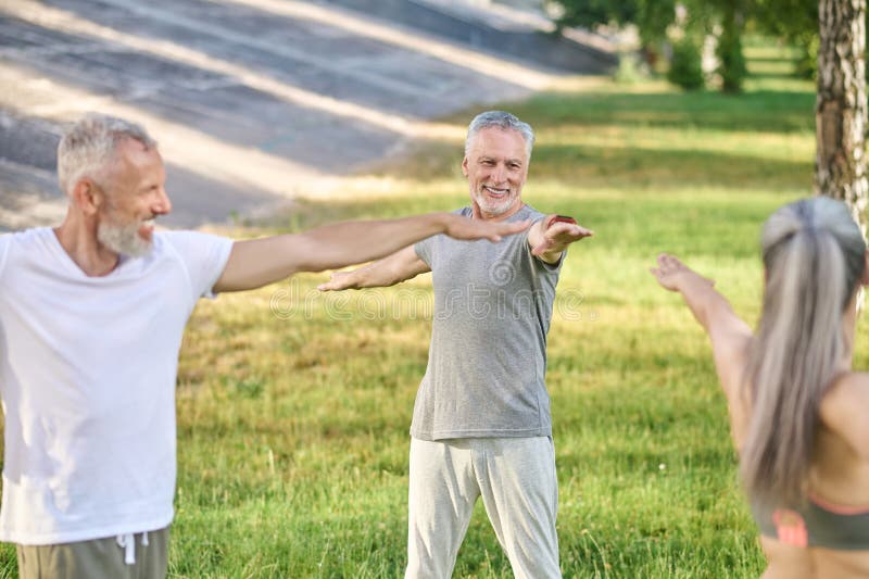 Group of Mid Aged People Having a Workout in the Park Stock Image ...