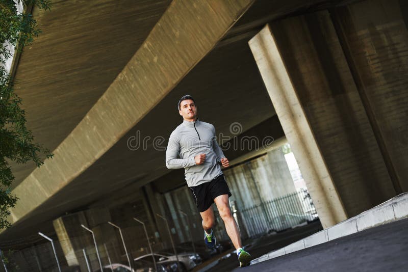 Keeping Fit Thanks To a daily Run. Determined Young Man Taking To the ...