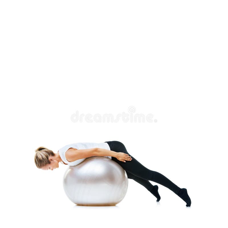 Keeping Healthy and Fit. a Woman Balancing on an Exercise Ball with ...