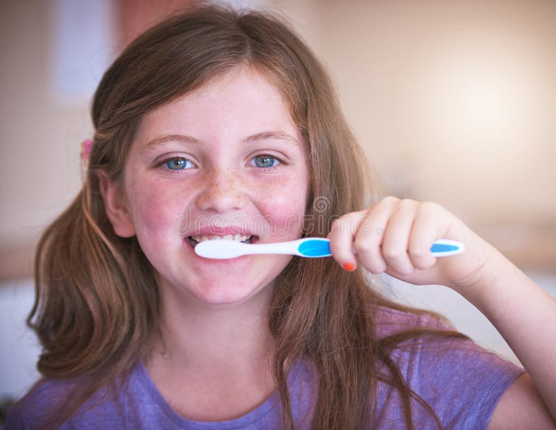 Keeping My Teeth in Tip-top Shape. a Little Girl Brushing Her Teeth ...