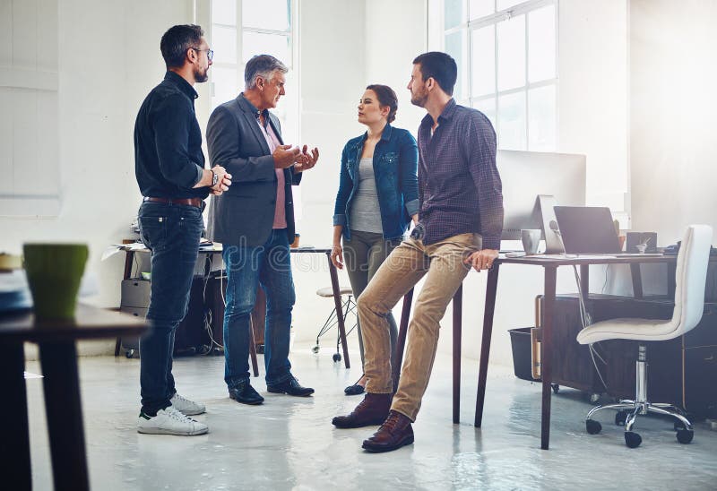 Keeping Their Brilliance on Target. a Group of Designers Having a ...