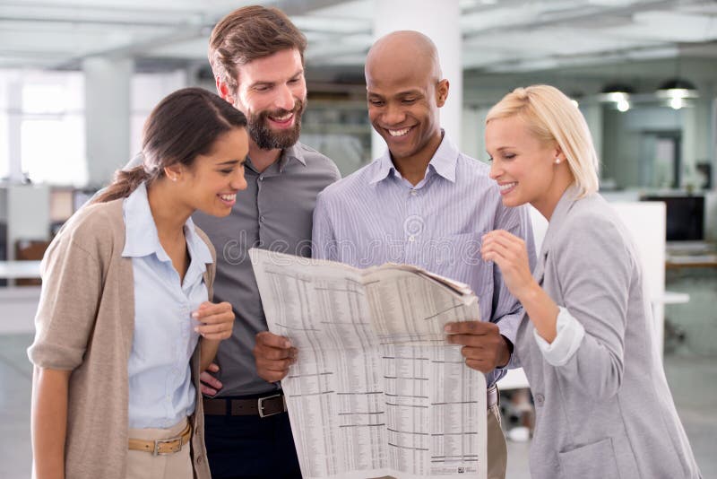 Keeping Up To Date with the Competition. a Group of Work Colleagues ...