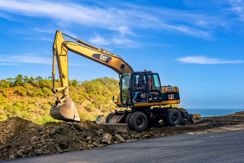Carrying Out Road Construction Works Using an Excavator Editorial Stock ...