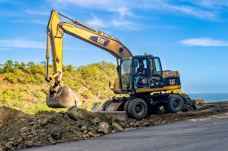 Carrying Out Road Construction Works Using an Excavator Editorial ...