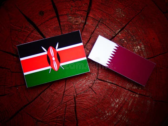 Kenyan Flag with Qatari Flag on a Tree Stump Isolated Stock Image ...