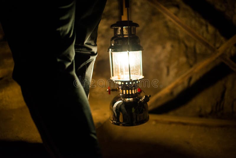 A Guy in an Ice Cave with a Lantern Light. Stock Image - Image of ...