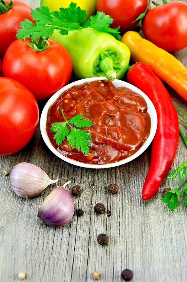 Ketchup with Vegetables and Spices on an Old Board Stock Photo - Image ...