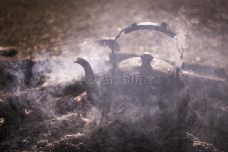 Kettle with Boiling Water Over a Campfire Stock Photo - Image of ...