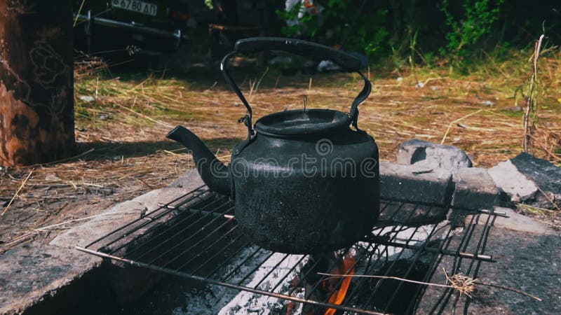 Kettle Boils on an Open Fire during the Day Stock Footage - Video of ...