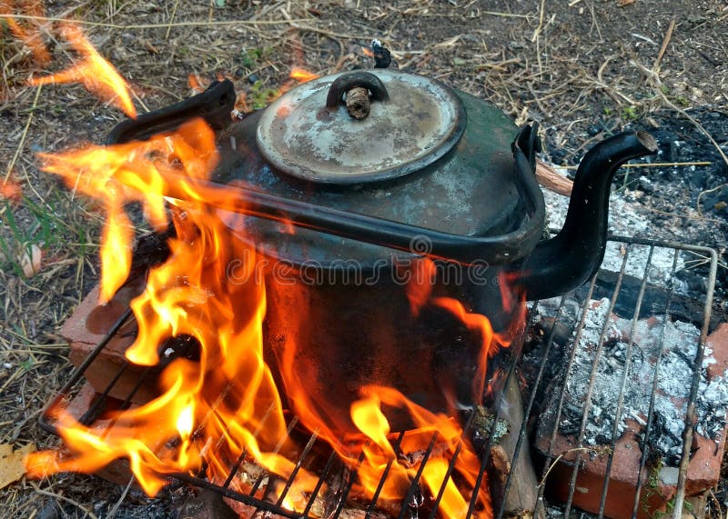 Kettle on the fire. stock image. Image of teapot, army - 95843351