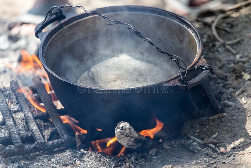 Kettle on a fire in nature stock image. Image of burn - 93614847