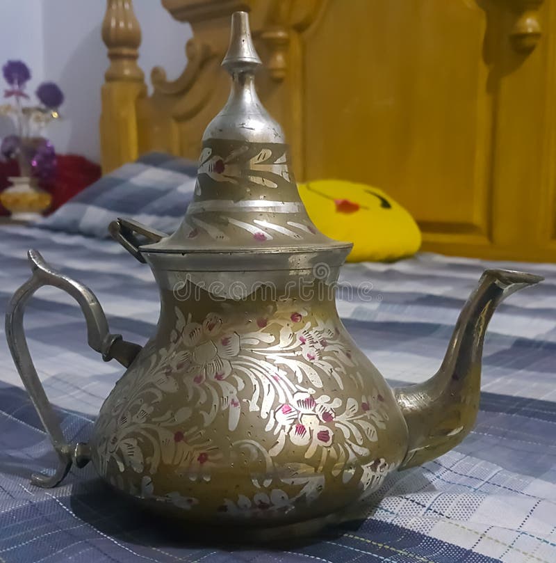 Kettle of Gold Colour with Decoration Stock Photo - Image of yellow ...