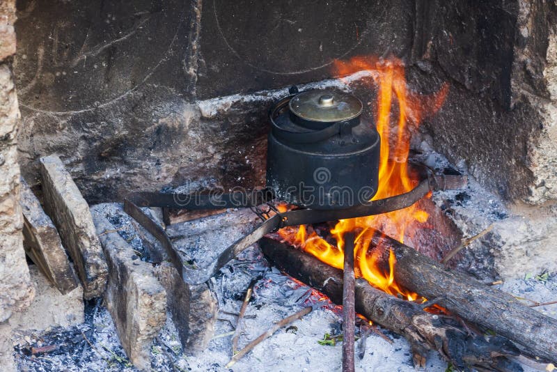 Kettle heated on a fire stock photo. Image of fireplace - 194183868