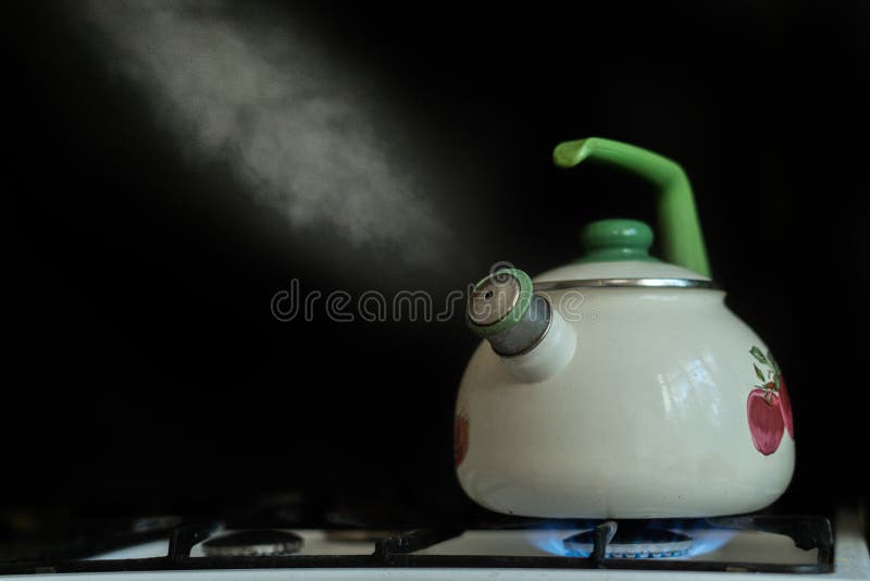The Kettle with Hot Boiling Water and the Steam Comes Out from it on ...