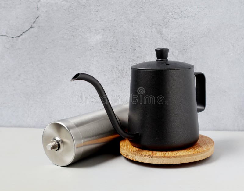 Kettle for Making Coffee and Disassembled Coffee Grinder. Stock Image ...