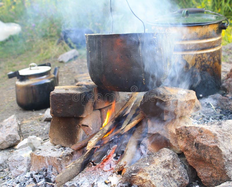 Kettle Over Burning Campfire Stock Image - Image of nature, black: 76610517