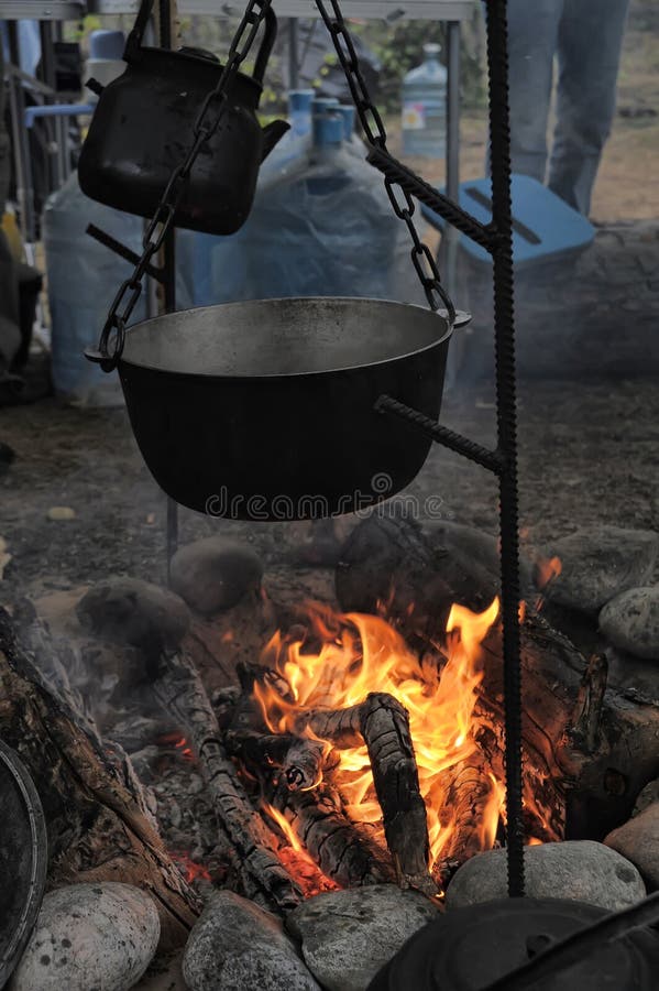 Kettle and pot on the fire stock photo. Image of burning - 33186824