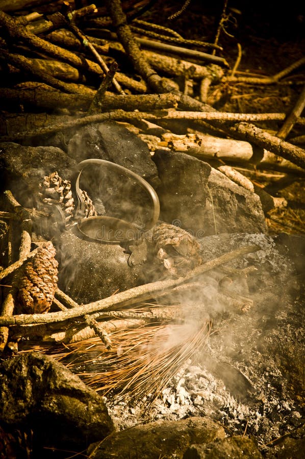 Kettle warming up in fire stock photo. Image of camp - 57579764
