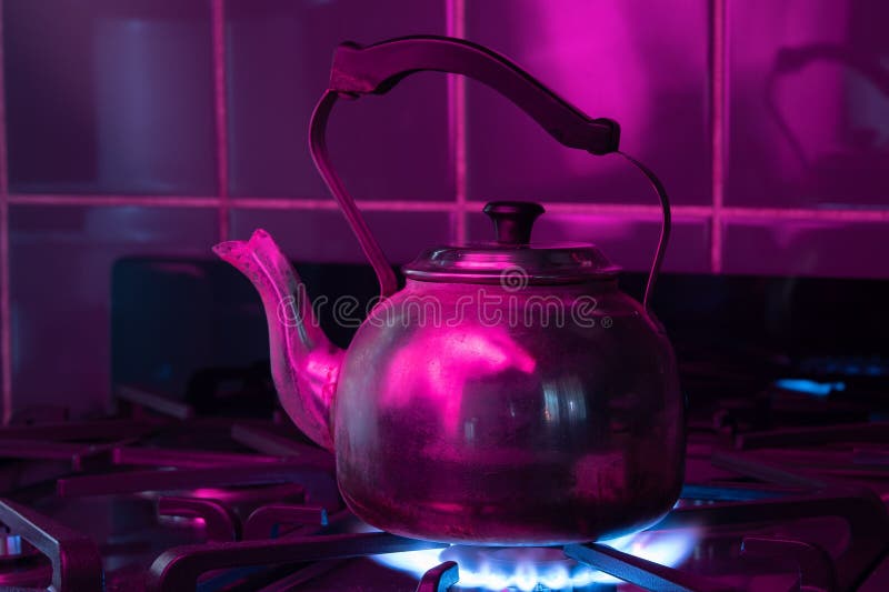 Kettle Warming Up on the Stove, with Neon Lights Stock Image - Image of ...