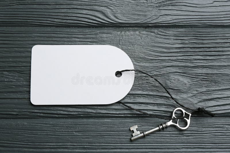 Key with Blank Tag on Grey Wooden Table, Top View. Keyword Concept ...