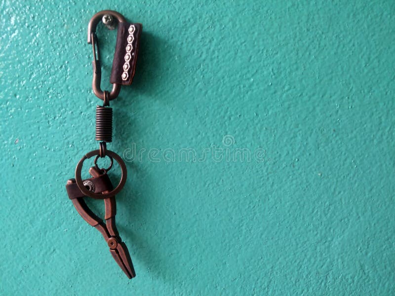 Key Chain Leather on Green Wall Concrete Stock Photo - Image of chrome ...