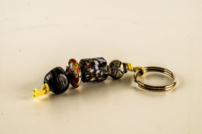 A Key Chain Made of Beads and a Yellow String Stock Photo - Image of ...